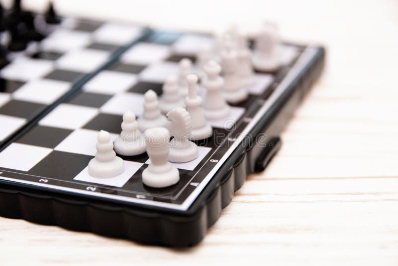 Small Pocket Chess, Plastic Chess Pieces Placed on a Chessboard on a ...