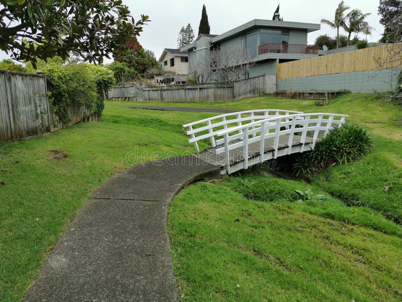 Small Pond and Decorative White Wooden Bridge in Park Stock Photo ...