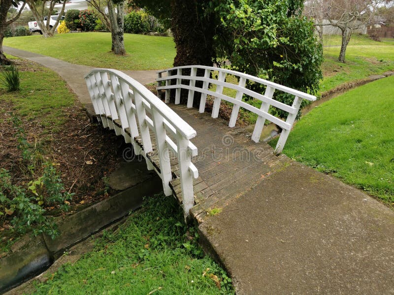 Small Pond and Decorative White Wooden Bridge in Park Stock Photo ...