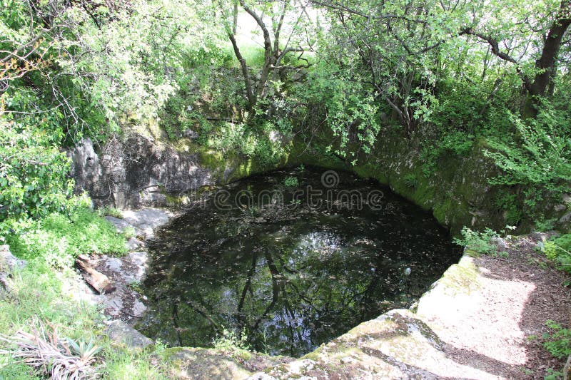 Small Pond with Surrounding Rock Stock Image - Image of water, pond ...