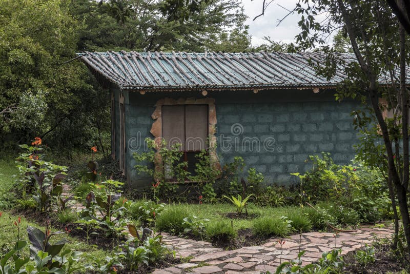A Small, Poor Village House in the Middle of a Garden Stock Photo ...
