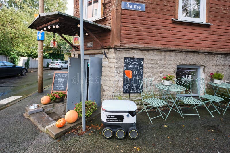 A Small Post Delivery Robot Sitting Outside of a Restaurant Editorial ...