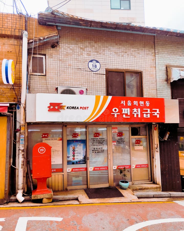 A Small Post Delivery Robot Sitting Outside of a Restaurant Editorial ...