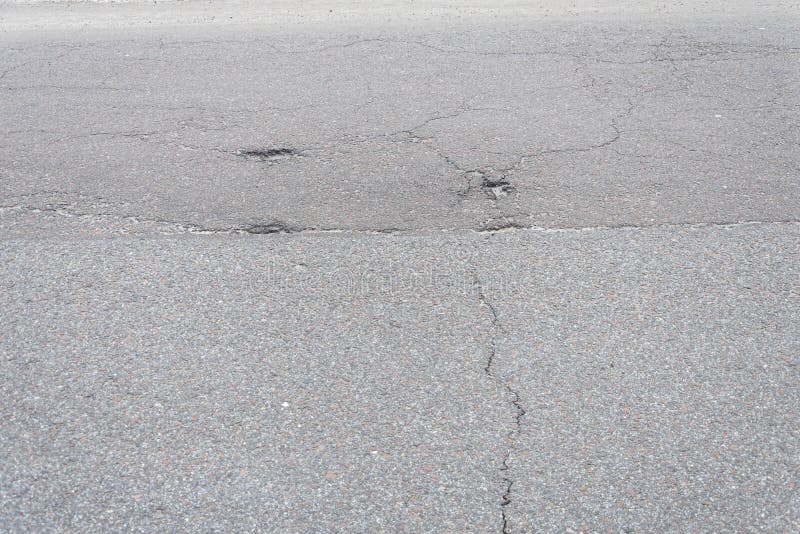 Small Potholes on the Asphalt Road, Pits and Destroyed Road Surface ...