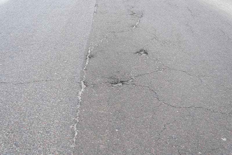 Small Potholes on the Asphalt Road, Pits and Destroyed Road Surface ...