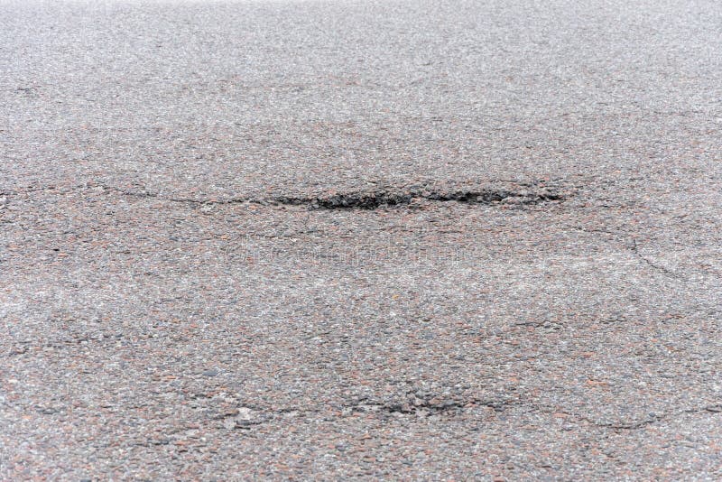 Small Potholes on the Asphalt Road, Pits and Destroyed Road Surface ...