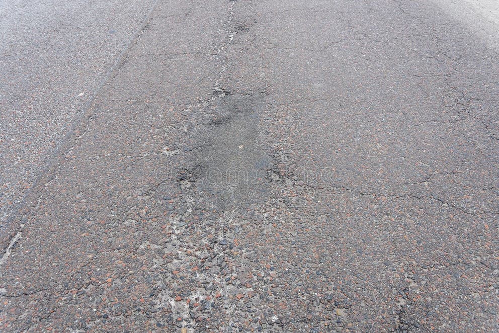 Small Potholes on the Asphalt Road, Pits and Destroyed Road Surface ...