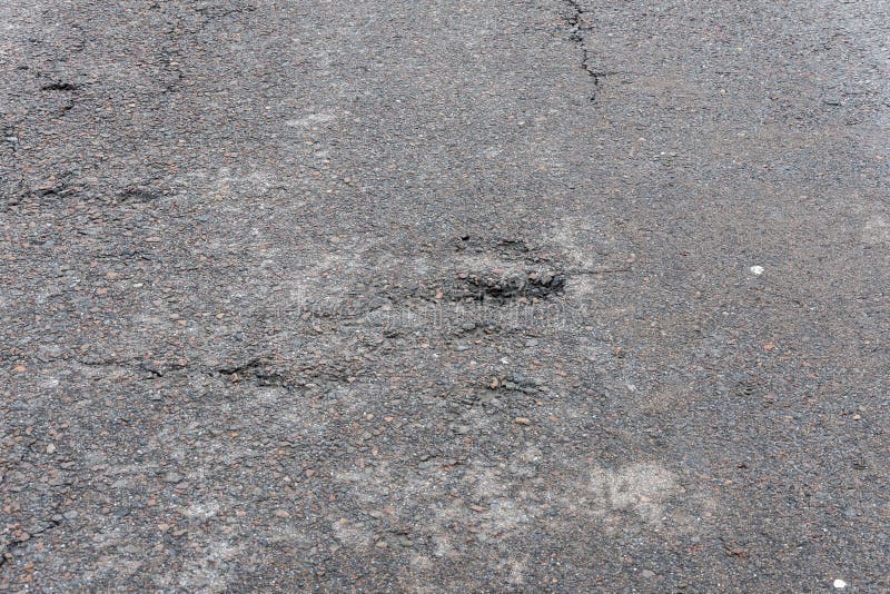 Small Potholes on the Asphalt Road, Pits and Destroyed Road Surface ...