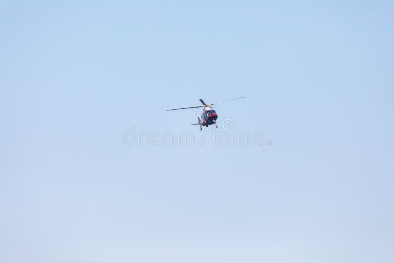 Small Private Helicopter on a Background of Blue Sky Stock Photo ...
