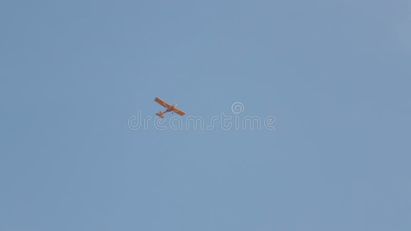 Small Propeller Plane Flying Low through a Cloudy Sky at Sunset Stock ...
