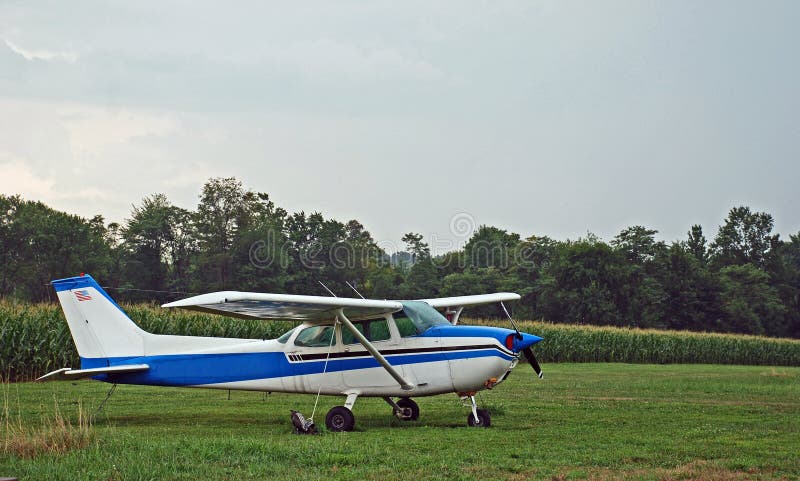 Small Plane on Rural Air Strip Stock Photo - Image of coming, color ...