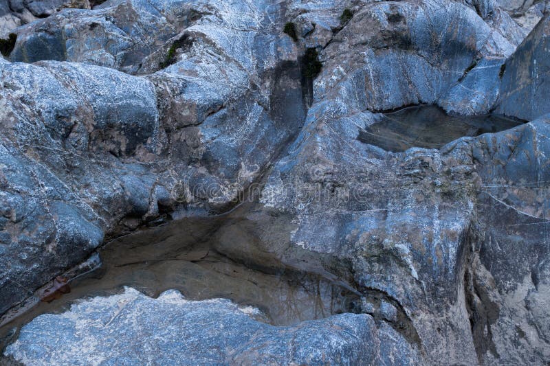 Small Puddle in Blue Rock Close Up Stock Photo - Image of pool, puddle ...