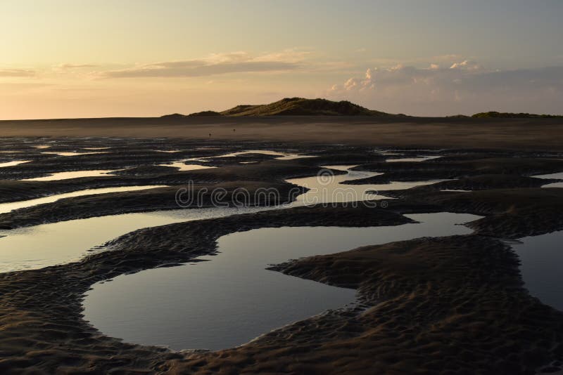 A Small Puddles in the Sand after Low Tide in Sunset Light Stock Photo ...
