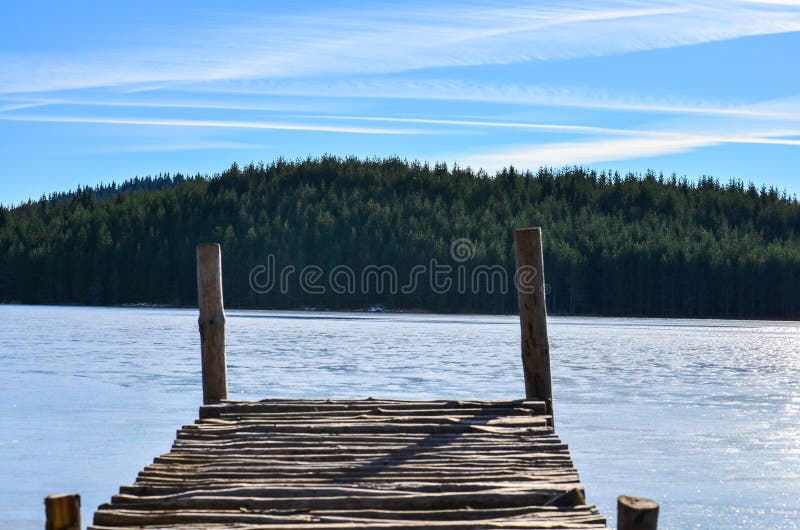 Small Quay on an Artificial Lake in the Mountains Stock Photo - Image ...