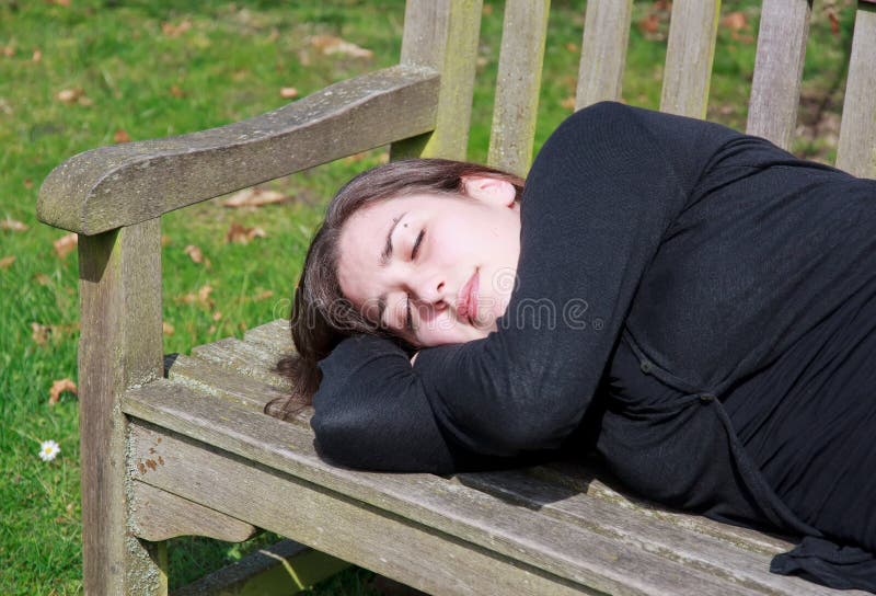 Small quiet nap on a bench stock image. Image of portrait - 31142221