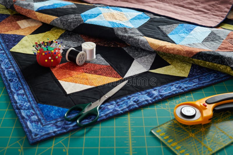 Small Quilt, Cutting Mat and Sewing and Quilting Accessories Stock ...