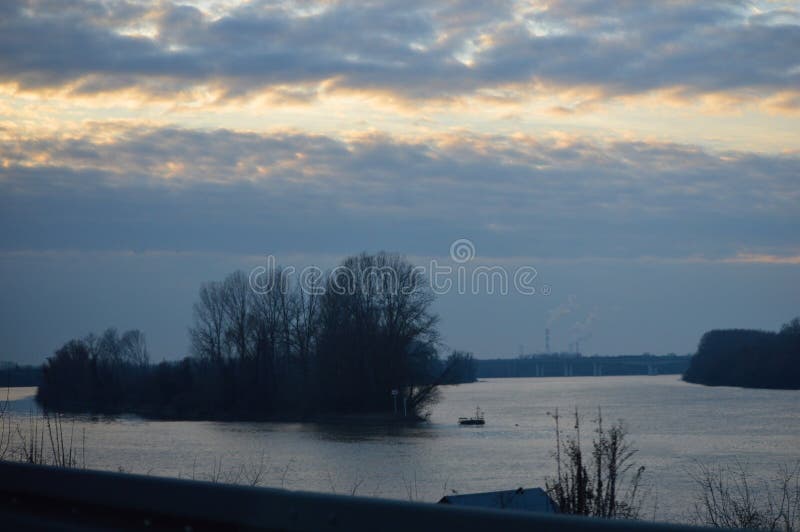 Small Raft on the River at Dusk Stock Photo - Image of water, dusk ...