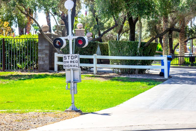Small Railroad Crossing Sign with Red Lights Stock Photo - Image of ...