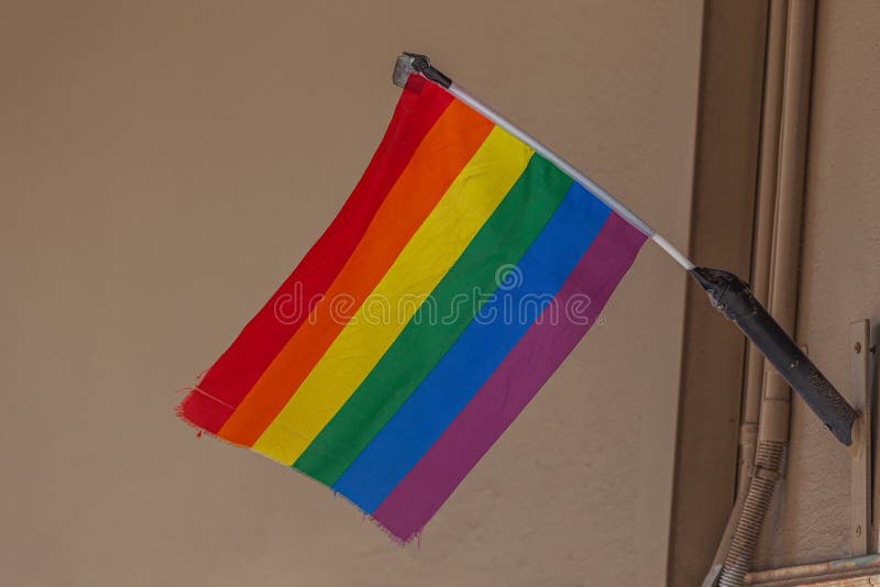 Small Rainbow Flag Hanging at an Angle Stock Image - Image of hanging ...