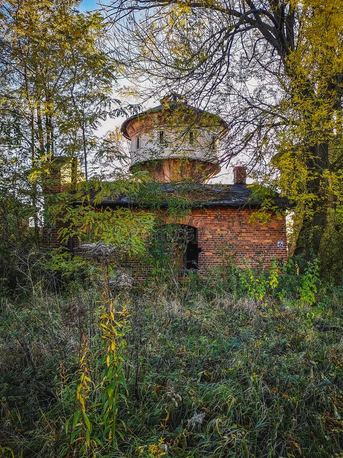 Small Red Brick Building with Tower Next To Train Station Stock Photo ...