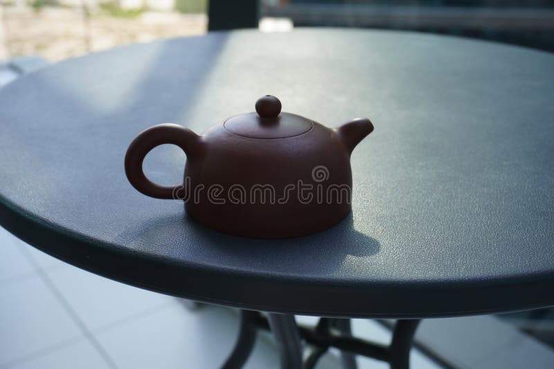 Small Red Chinese Teapot on the Round Black Table. Stock Image - Image ...