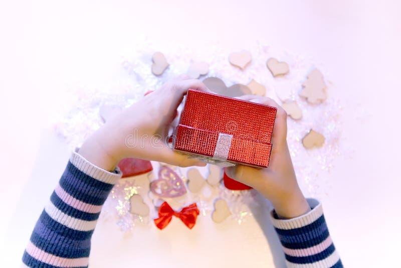 Small Red Gift Box in Child& X27;s Hands. Christmas and NewYear Decor ...