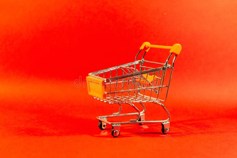 Small Red Shopping Cart on Gray Background Stock Photo - Image of ...