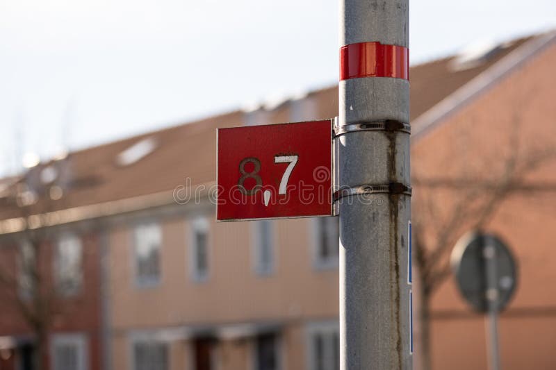 Small Red Sign Telling the Direction and Distance To Teh Nearest Water ...