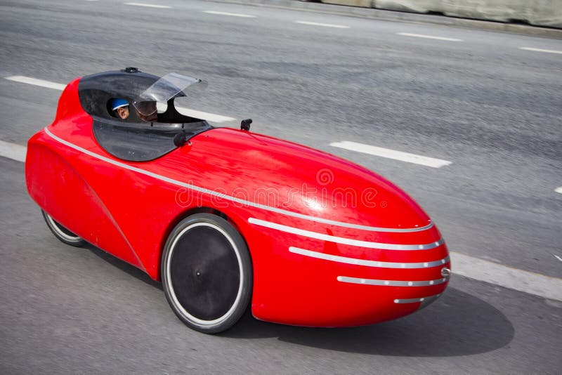 Small red three wheel car stock photo. Image of passenger - 73013268