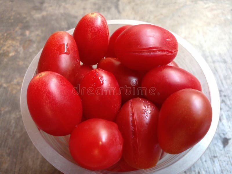 Small Red Tomatoes Placed in a Plastic Cup. Fresh Red Tomatoes Stock ...
