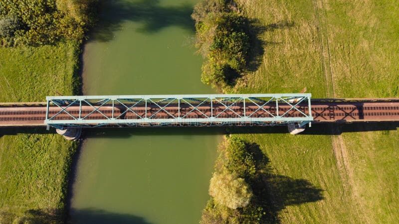 A Small River Across the Lowlands with Bridge Stock Photo - Image of ...