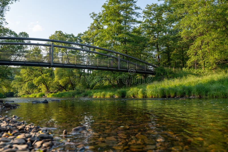 A Small River from the Bank, with a Bridge Stock Photo - Image of sunny ...