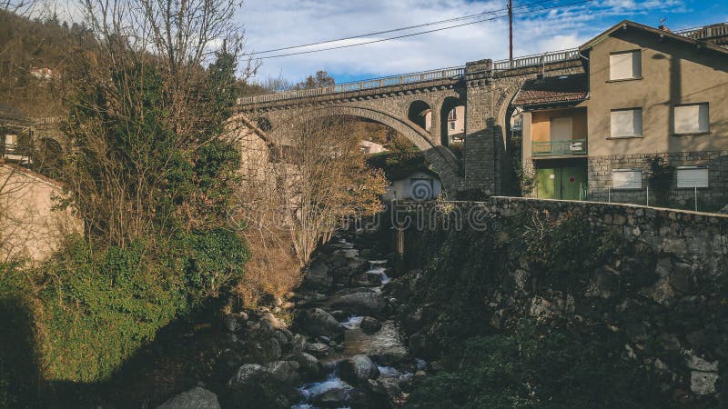 Small River Flowing from the Pyrenees Mountain Range Under a ...