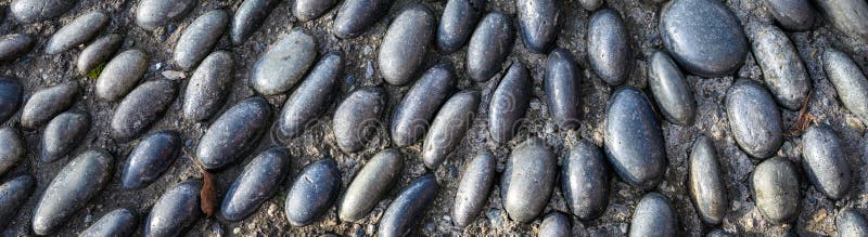 Small River Rocks Set in Concrete in a Abstract Pattern, As Graphic ...