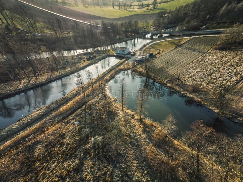 Landscape with a River and the Setting Sun. Stock Photo - Image of ...