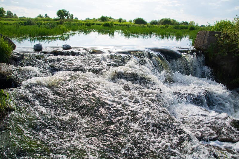 A Small River Waterfall on a Bright Sunny Summer Day Stock Photo ...