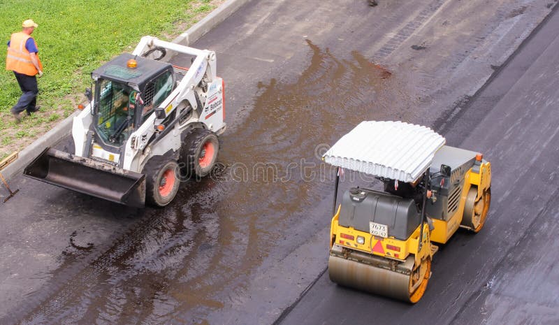 Small Road Construction Machinery at Work. Editorial Image - Image of ...