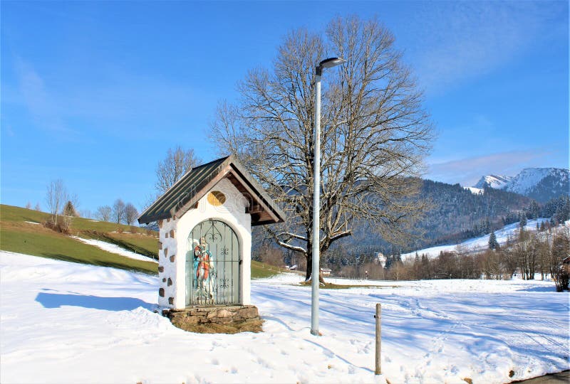 A Little Shrine with a Statue of a Saint Person at the Side of the Road ...