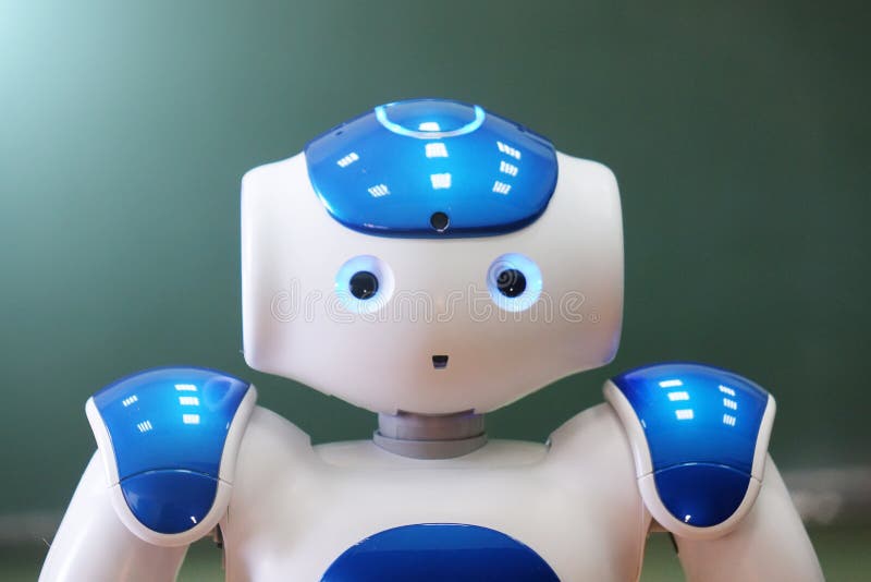 A Small Robot with a Human Face and a Humanoid Body. Blue-and-white ...