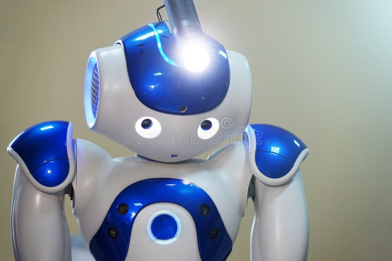 A Small Robot with a Humanoid Body on a Blue Background . Artificial ...