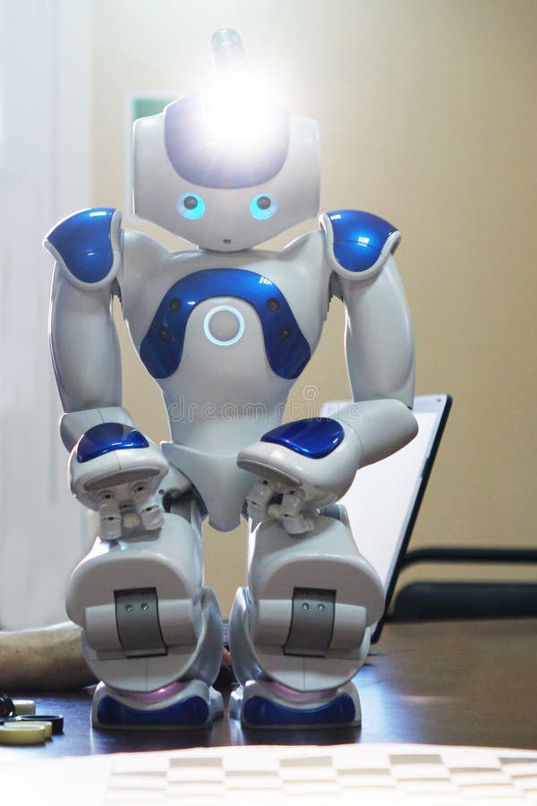A Small Robot with a Human Face and a Humanoid Body. Artificial ...