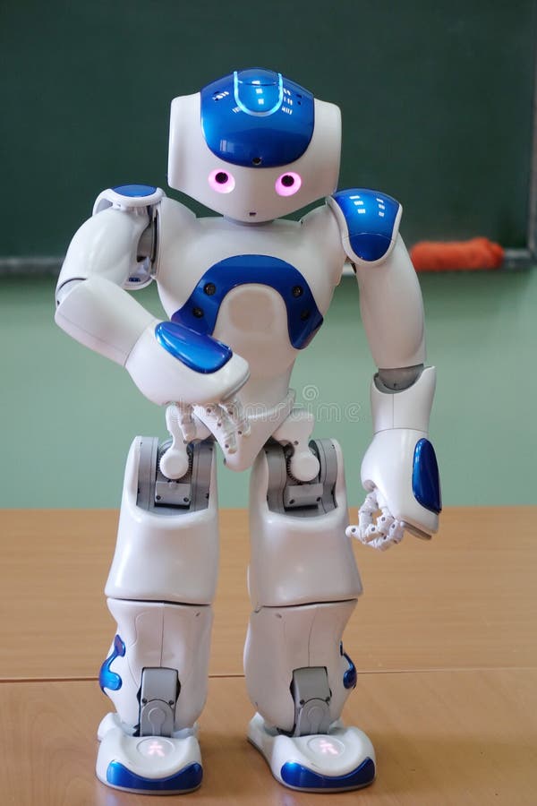 A Small Robot with a Human Face and a Humanoid Body. Blue-and-white ...
