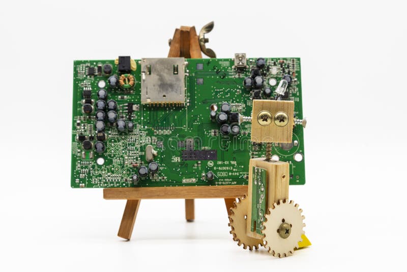 Small Robots Made with Wood in Front of an Electronic Circuit Stock ...