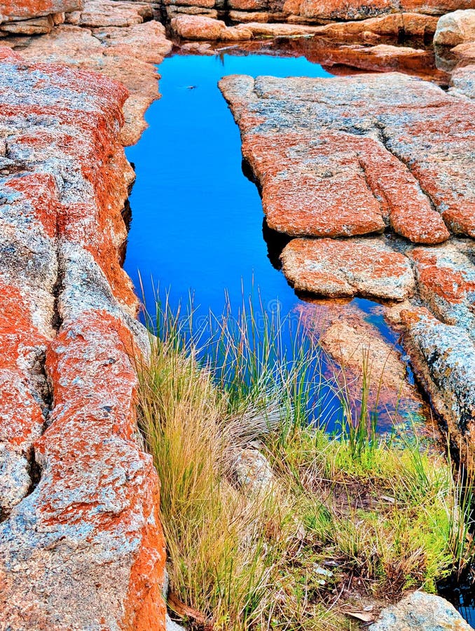 Bicheno Foreshore with Orange Colour Rocks, Tasmania, Australia. Stock ...