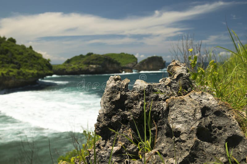 Small Rock with Huge Cliffs by Watu Karung Beach Stock Image - Image of ...
