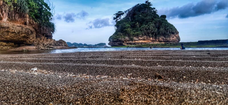 A rock island stock photo. Image of cliff, small, beach - 191819890