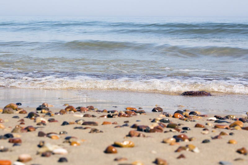 Small Rocks Scattered on Beach Sand Close Up. Stock Photo - Image of ...