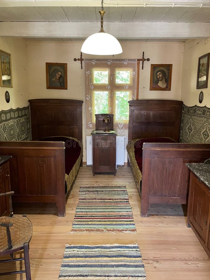 A Small Room with Two Beds and a Table Stock Photo - Image of lamp ...