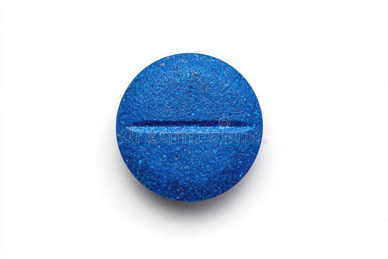 Close Up of a Small, Round, Blue Pill with a Score Line on a White ...