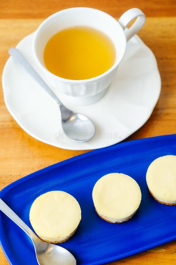 Small Round Cheesecakes Served with a Cup of Tea Stock Photo - Image of ...